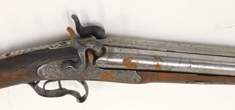 A 19thC Continental double barrel hammer action sporting gun, with ...