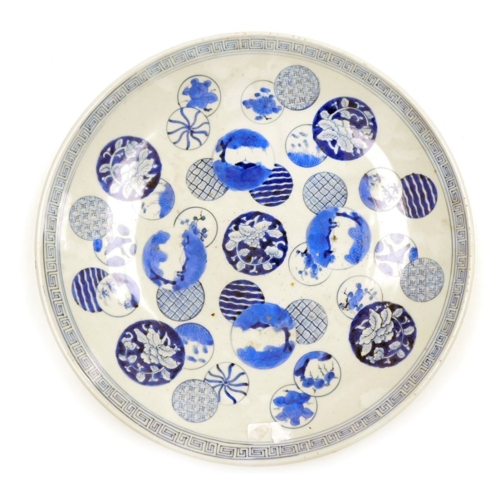 A 19thC Japanese porcelain charger, with blue and white decoration of ...