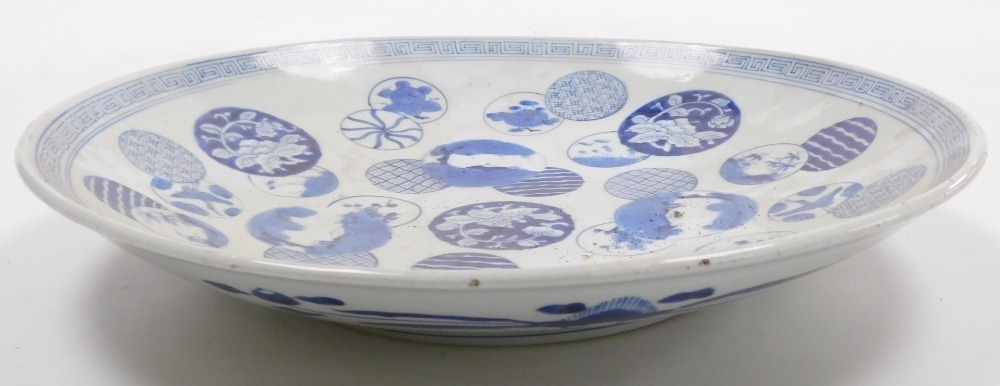 A 19thC Japanese porcelain charger, with blue and white decoration of ...
