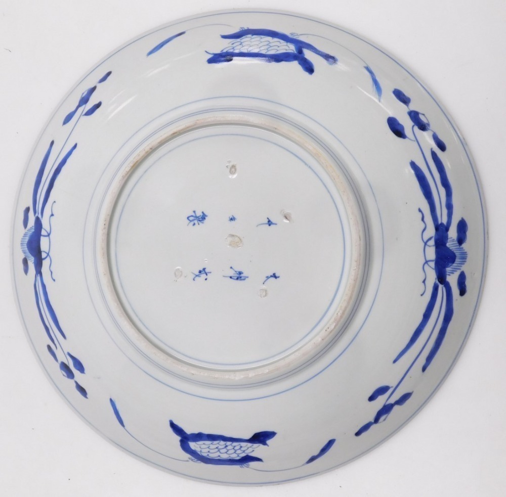 A 19thC Japanese porcelain charger, with blue and white decoration of ...