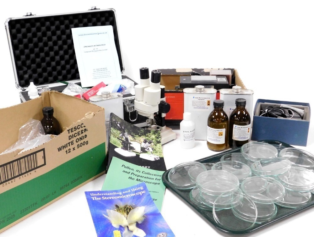 A compound microscope case, microscope, petri dishes, assorted tools ...