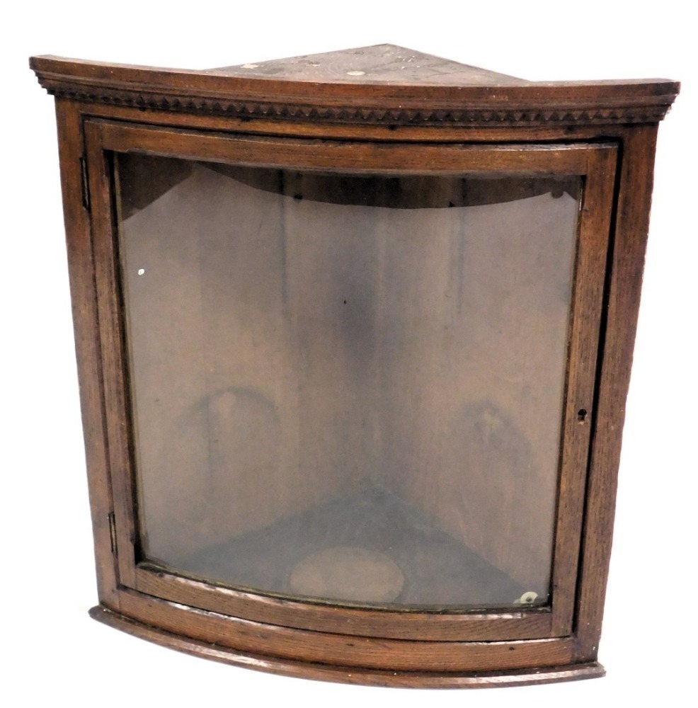 A Victorian oak hanging corner display cabinet, with a glazed door ...