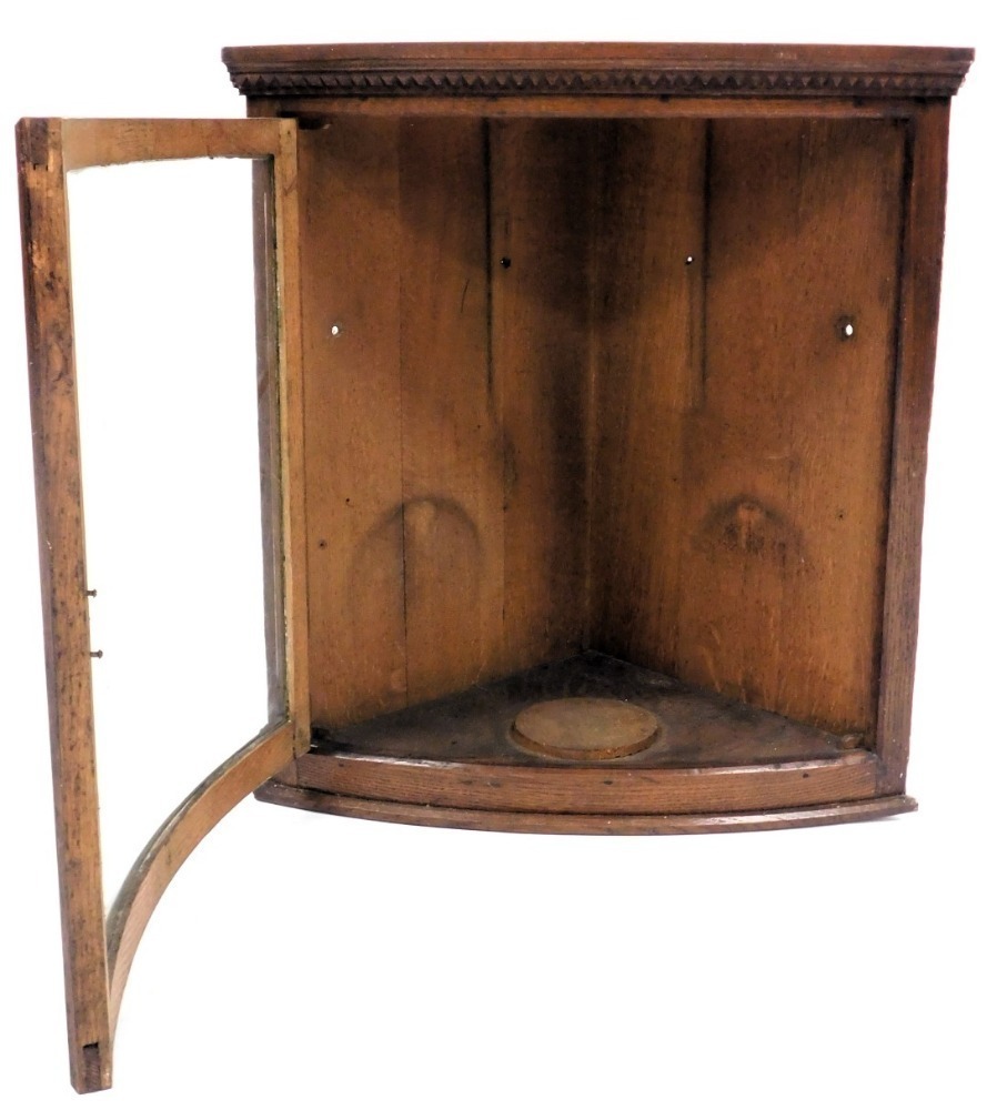 A Victorian oak hanging corner display cabinet, with a glazed door ...