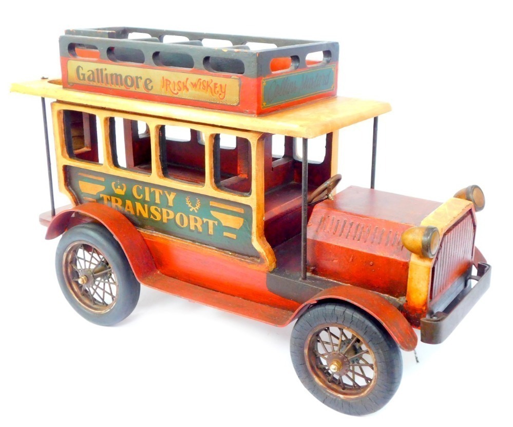 A 20thC wooden model of a vintage double decker bus, sign written for ...