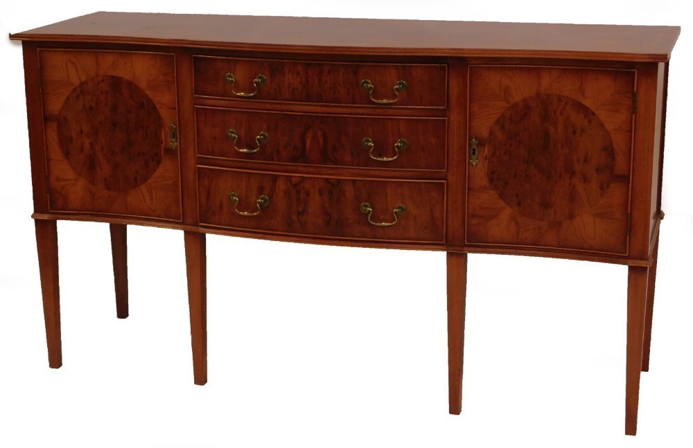 A 20thC reproduction yew wood veneered extending dining table, the ...