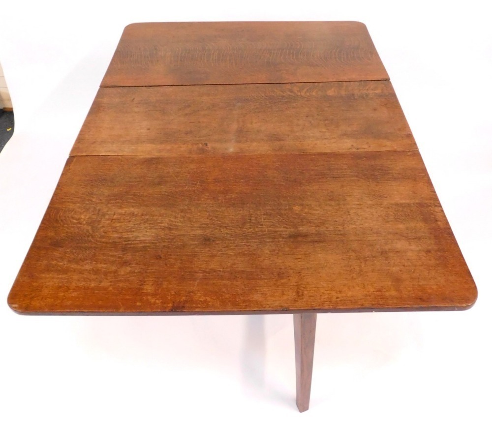 An 18thC oak rectangular drop leaf table, of plain design with rounded ...