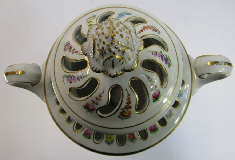 A mid 20thC Dresden porcelain two handled urn and cover, with pierced ...