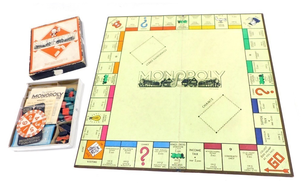 A John Waddington Limited Monopoly set, with card number spinner, card ...