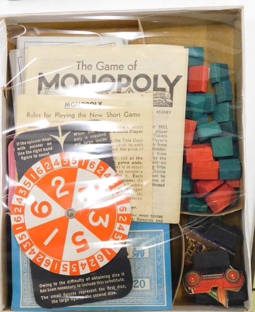 A John Waddington Limited Monopoly set, with card number spinner, card ...