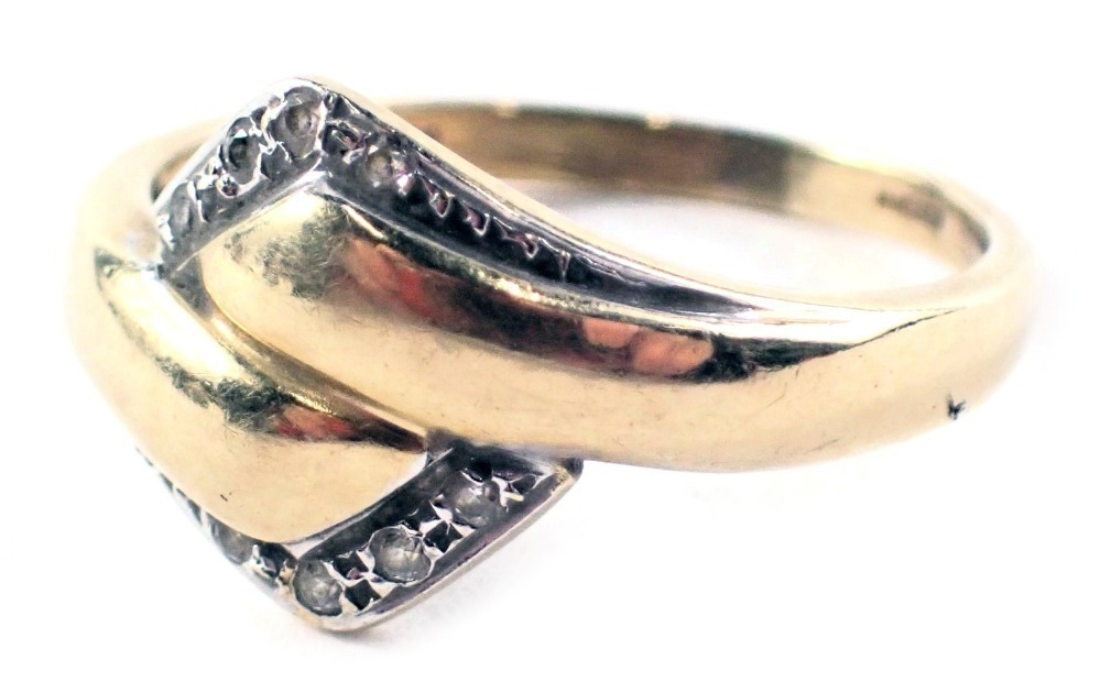 A twist design dress ring, the central crossover section with outer ...