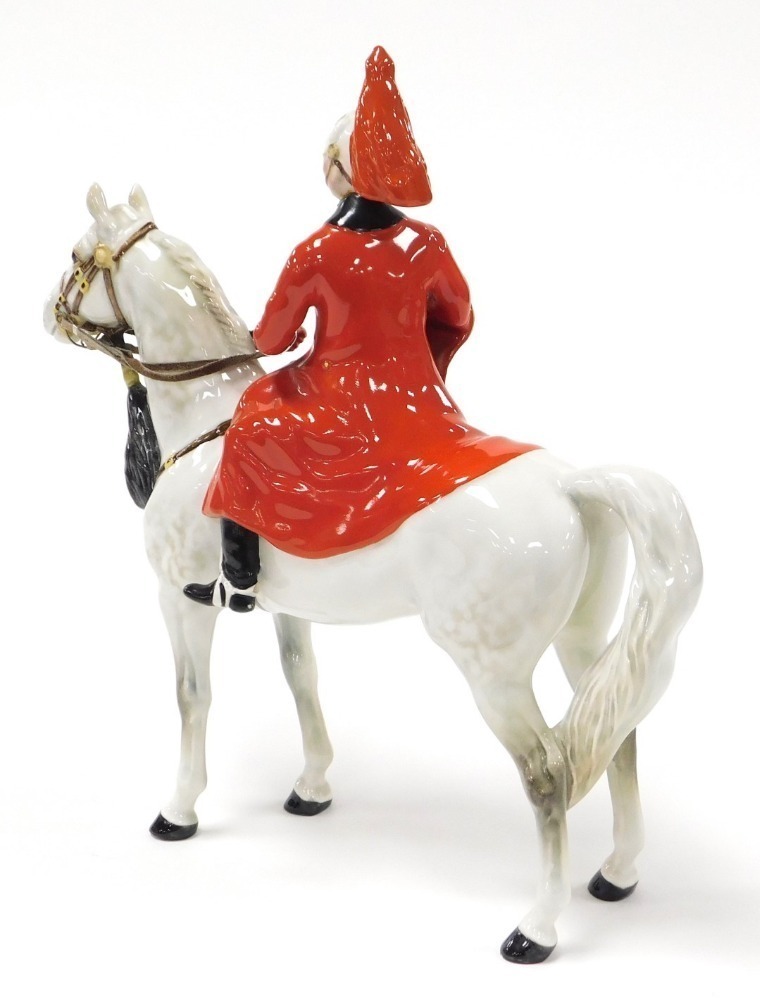 A Beswick pottery figure of a Lifeguard, mounted on a dappled grey ...