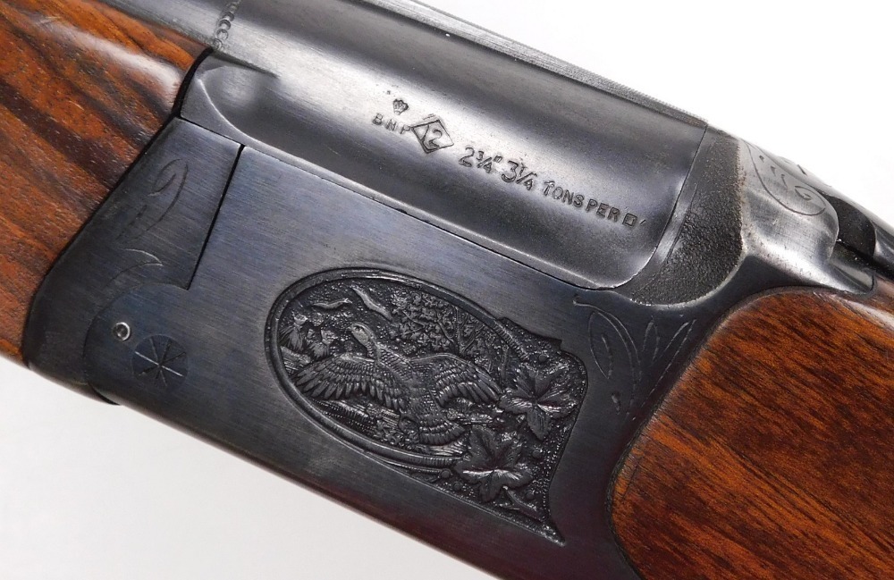 A Baikal 12 bore over/under shot gun, IJ-27, with proof marks, serial ...
