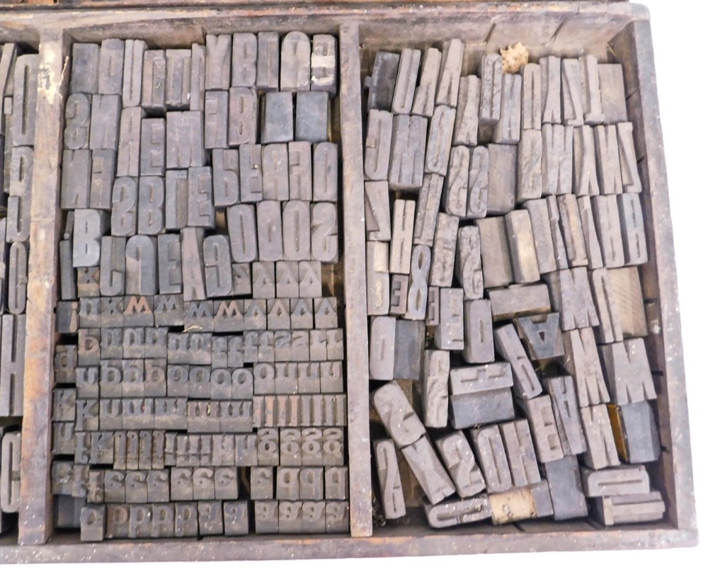 Two trays of printing blocks, to include letters and numbers, various ...