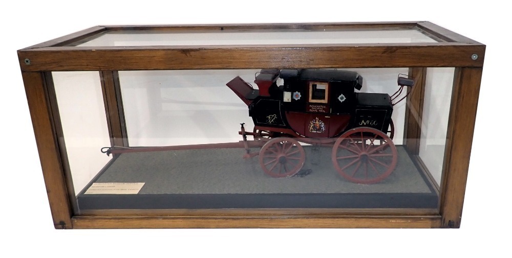 A scale model of the Doncaster to Halifax mail coach, decorated in dark ...