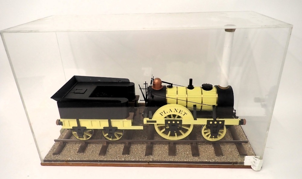 A scale model of Stephenson's Planet locomotive circa 1830, in black ...