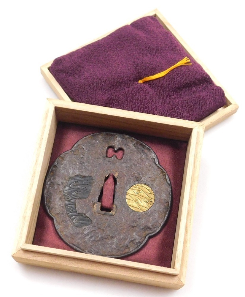A Muromachi period iron tsuba, Saotome school, of mokko shape ...
