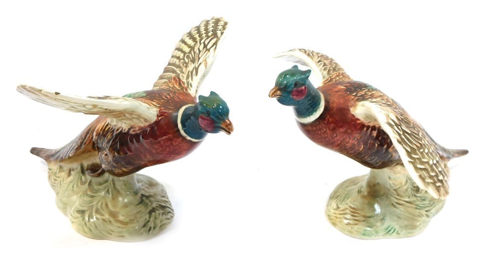 Two Beswick pottery figures modelled as pheasants in flight, 849 and ...