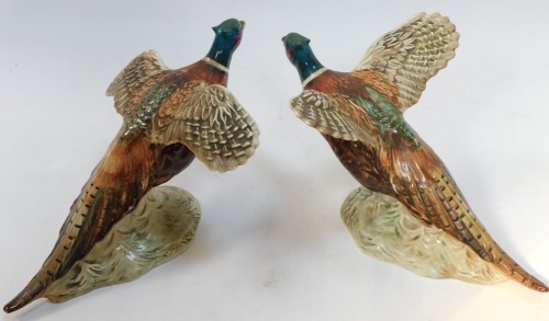 Two Beswick pottery figures modelled as pheasants in flight, 849 and ...