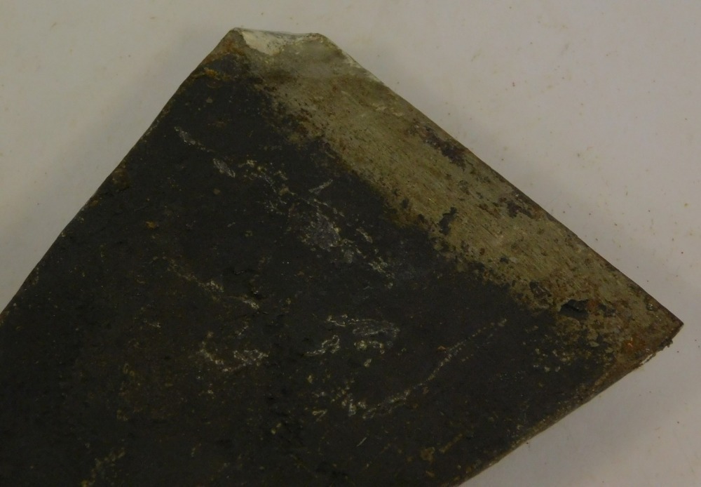 A carved tribal axe, with Aztec carved decoration, with axe head, and ...