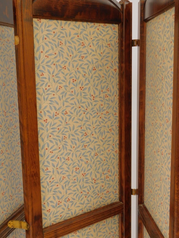 A 20thC Continental beech framed four fold screen, each with an arched ...