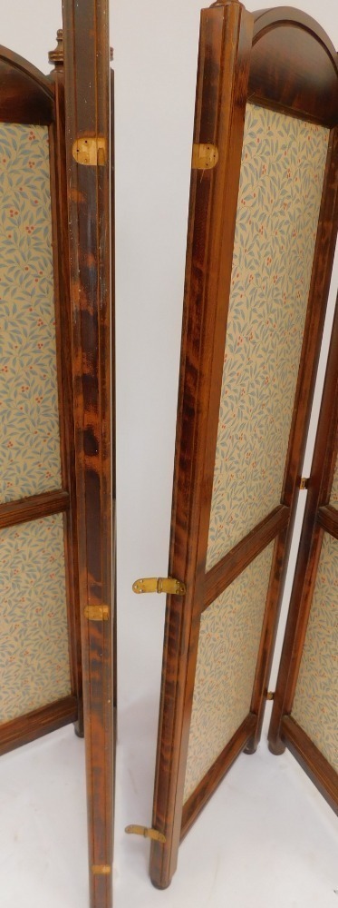A 20thC Continental beech framed four fold screen, each with an arched ...