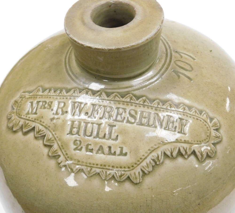 A 19thC olive stoneware two gallon jar, number 101, with raised banner ...