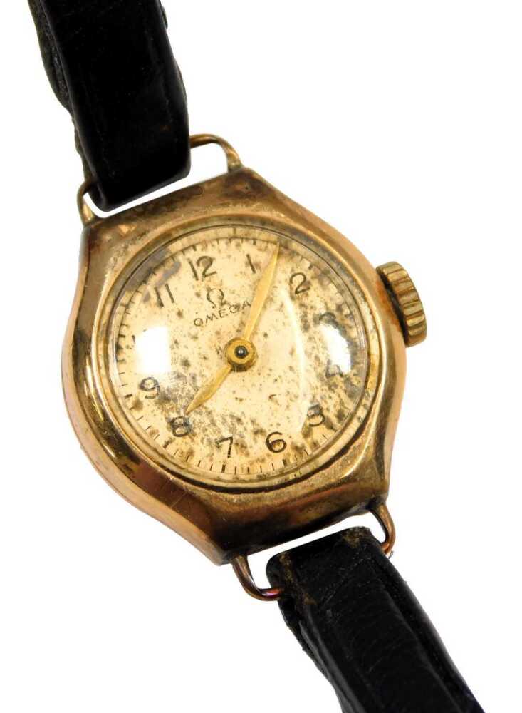An Omega 9ct gold cased lady's wristwatch, the circular watch head on a ...