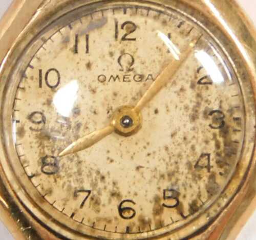 An Omega 9ct gold cased lady's wristwatch, the circular watch head on a ...