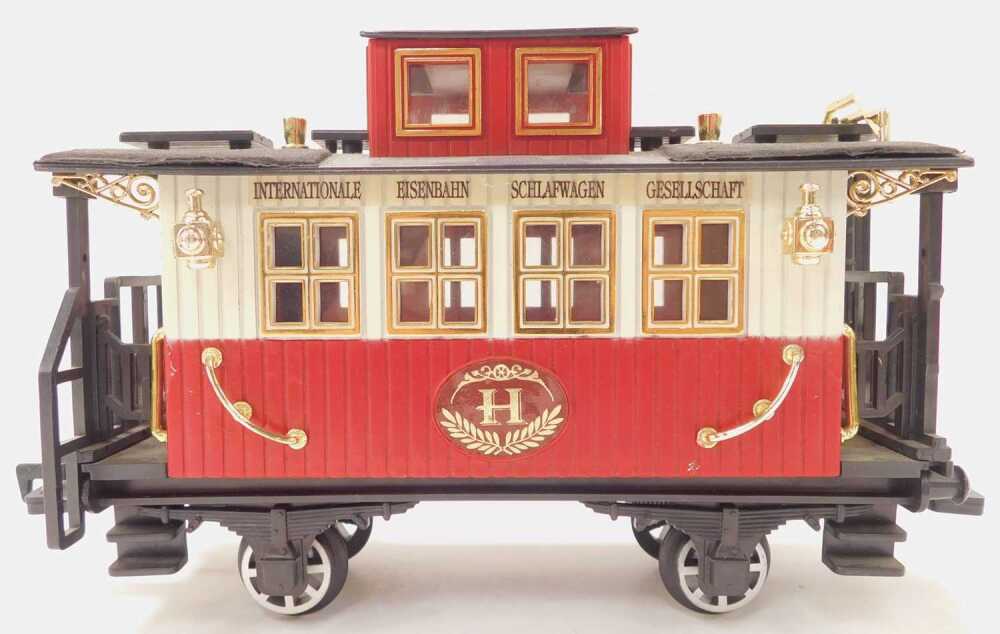 Bachmann and Playmobil G scale rolling stock, including caboose, plank ...