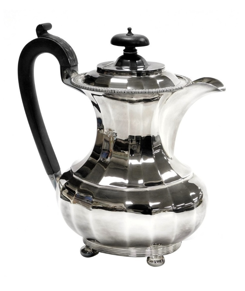 A George V silver coffee pot, of fluted baluster form, Chester 1935, 26 ...