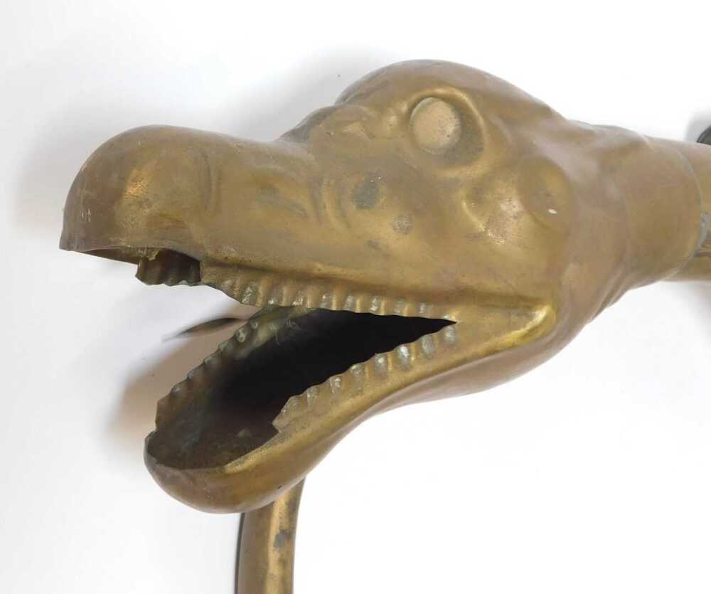 An early 20thC brass serpent's head horn. (AF)