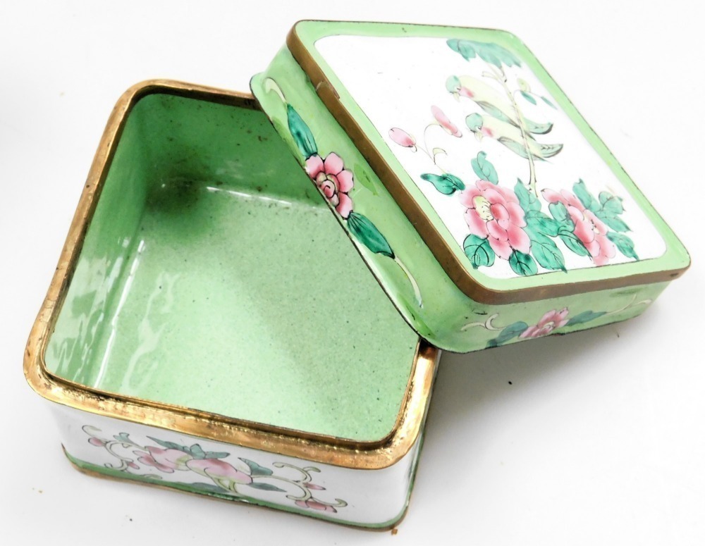 A group of Chinese enamel boxes and covers, of square form, decorated ...