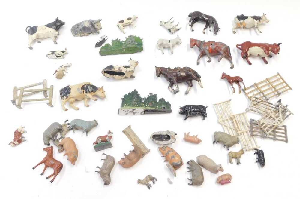 A group of painted lead farm animals, to include cows, 5cm high, pigs ...