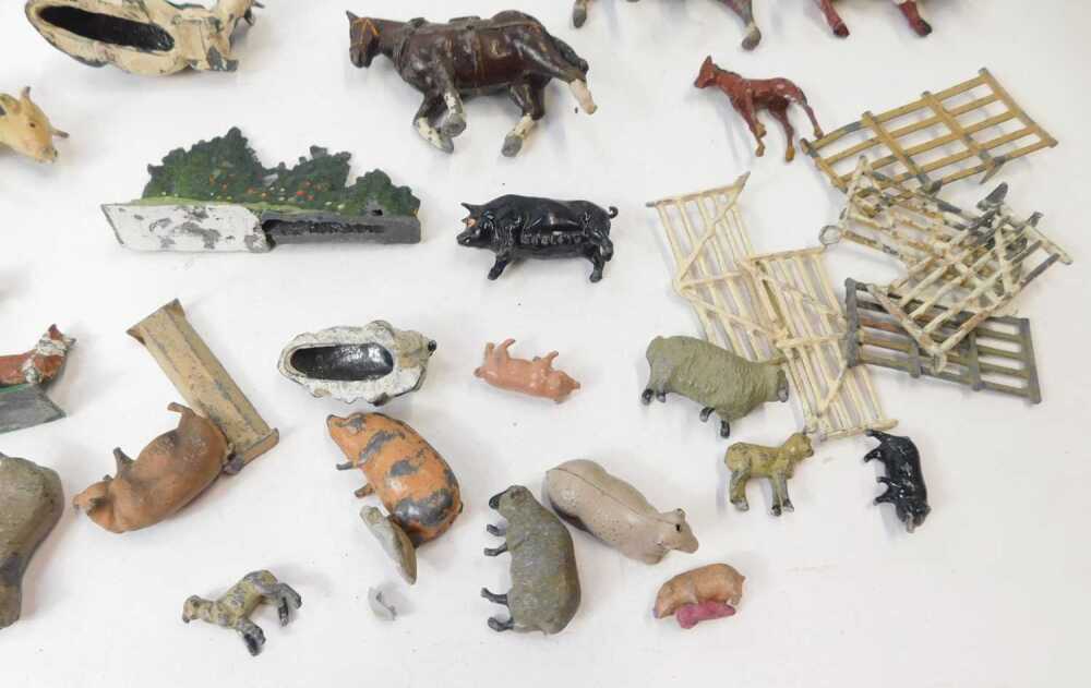 A group of painted lead farm animals, to include cows, 5cm high, pigs ...