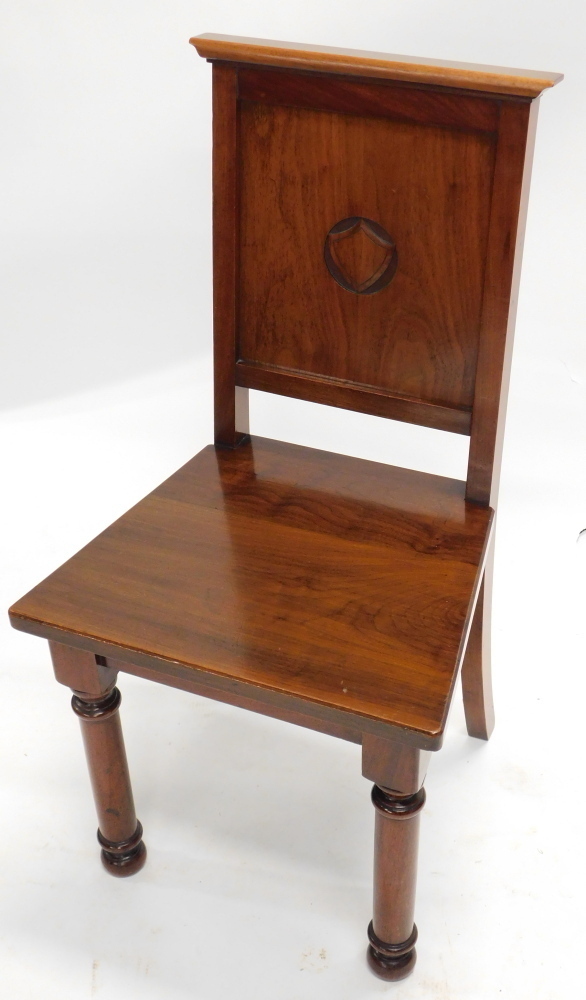 A late 19th/early 20thC walnut hall chair, the panelled back decorated ...