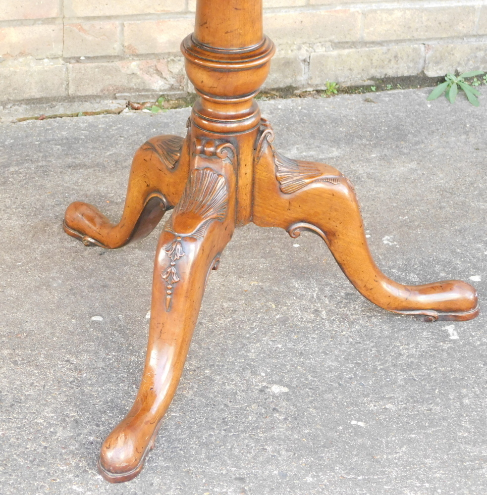 A Titchmarsh and Goodwin figured walnut extending dining table, the ...