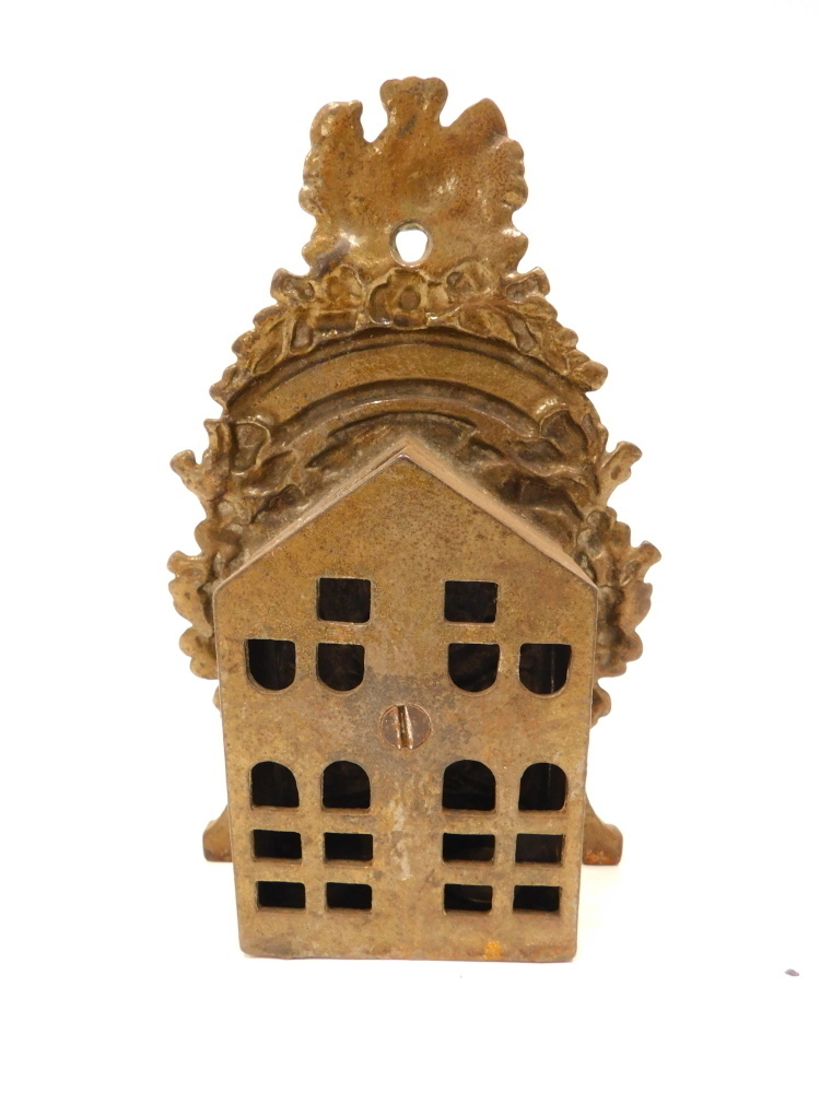 A gilt coloured cast iron money box, decorated with the Lord Kitchener ...