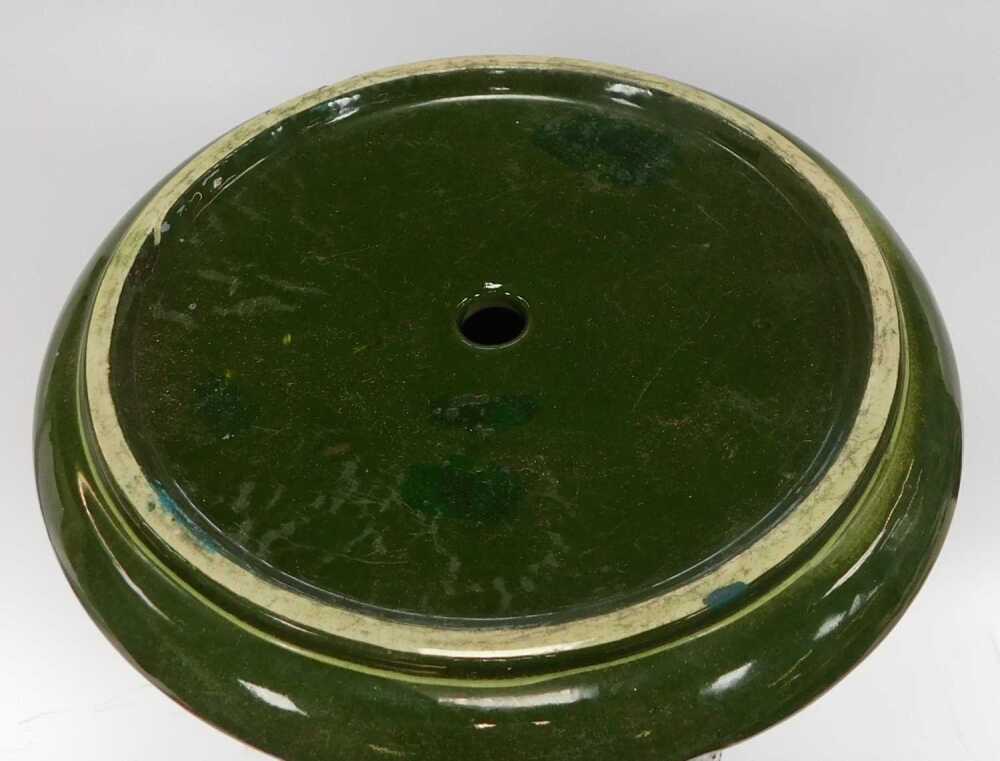 A late 19thC pottery jardiniere stand, decorated with blue and pink ...