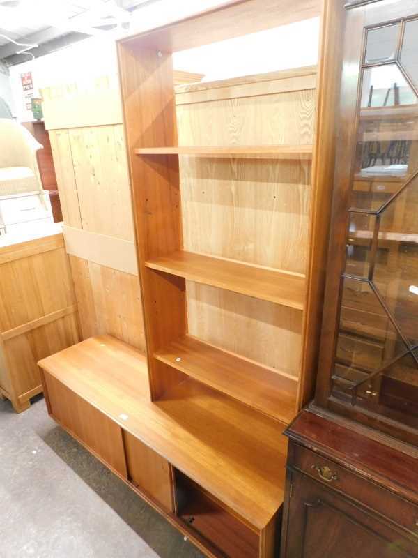 A G-Plan teak low sideboard, with two sliding doors, on a plinth base ...