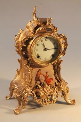 An American gilt cased rococo style mantel clock