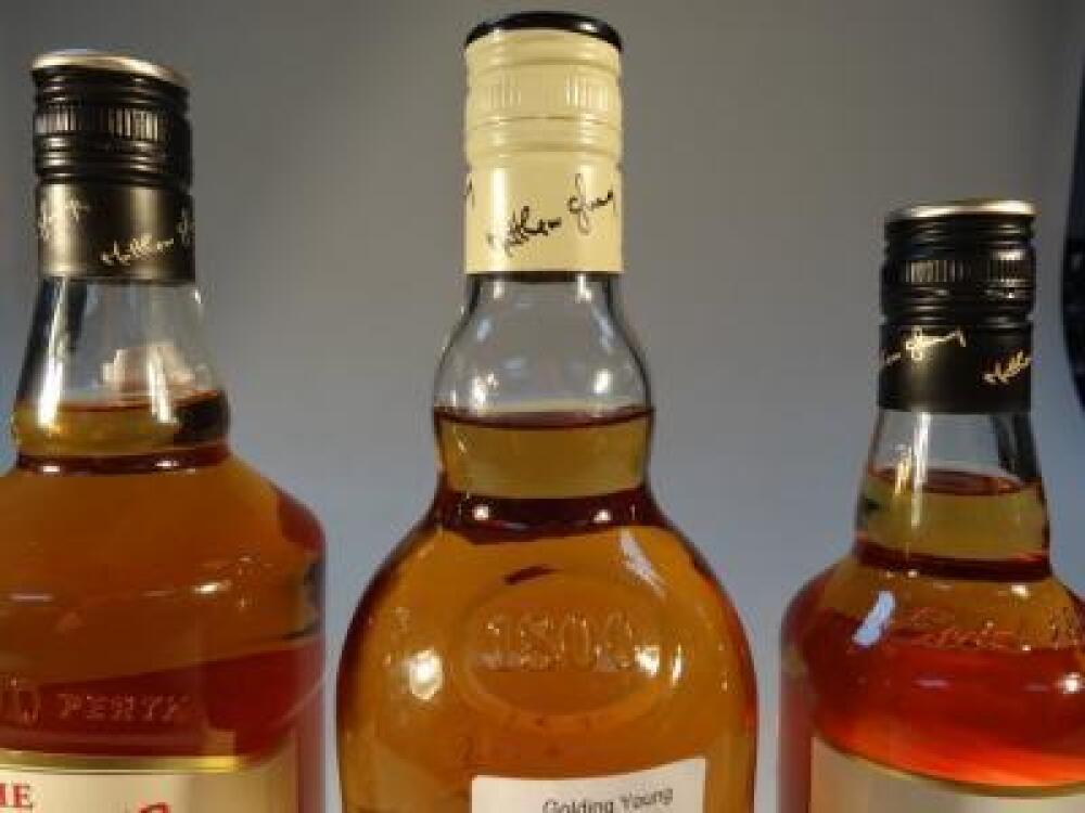 Three bottles of The Famous Grouse Blended Scotch Whisky