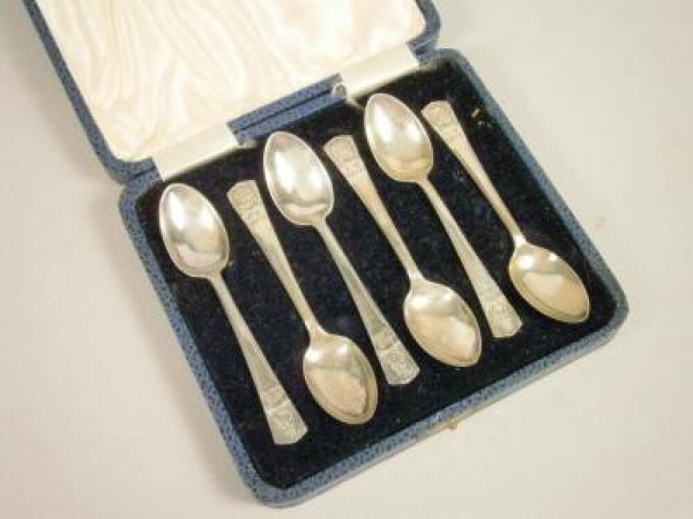 A George V set of six silver commemorative teaspoons