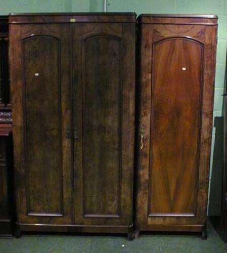 A Victorian 2 door walnut wardrobe with inset arched panels and on ...