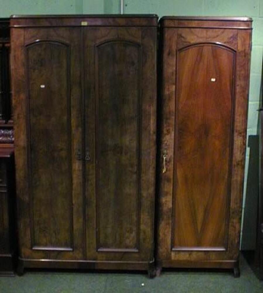 A Victorian 2 door walnut wardrobe with inset arched panels and on ...