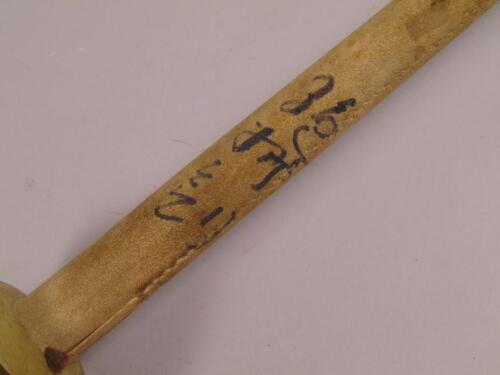 A Japanese bamboo and suede leather practice sword