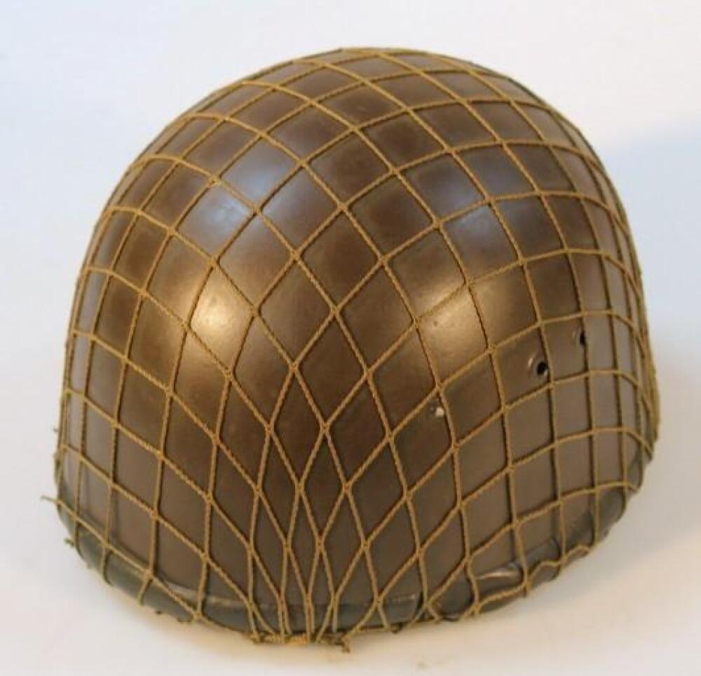 An East German steel tank crew helmet.