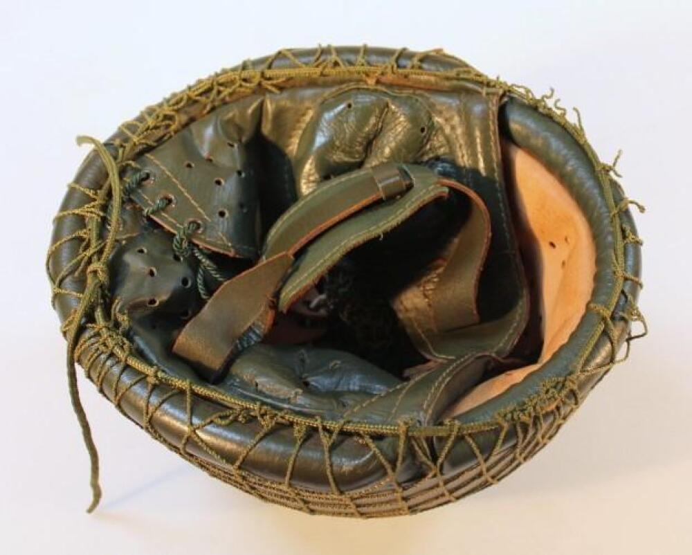 An East German steel tank crew helmet.