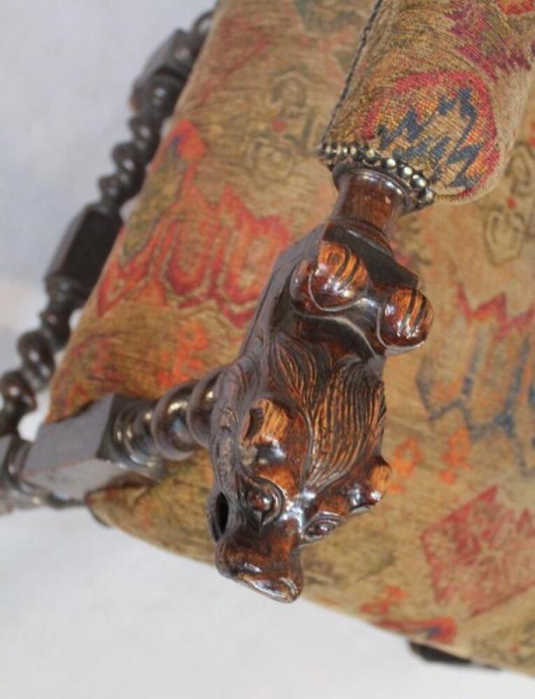 A Black Forest oak Carolean style armchair