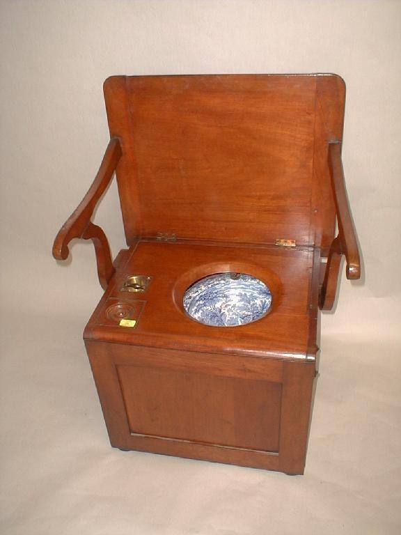 A 19thC mahogany campaign commode of box form with cantilever arms ...