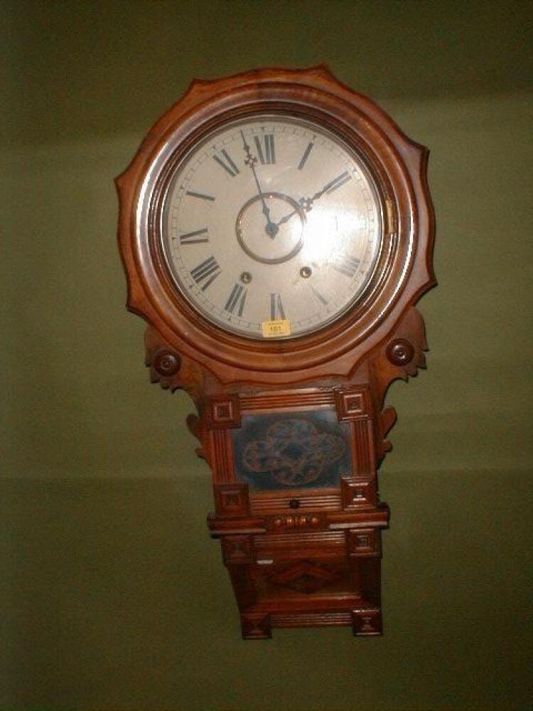 A walnut cased drop dial wall clock with shaped and moulded bezel
